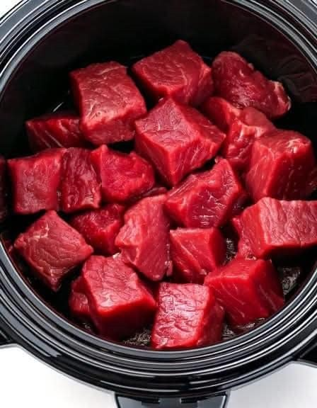 Put raw cubed beef in a slow cooker with these 3 ingredients. You won’t ...